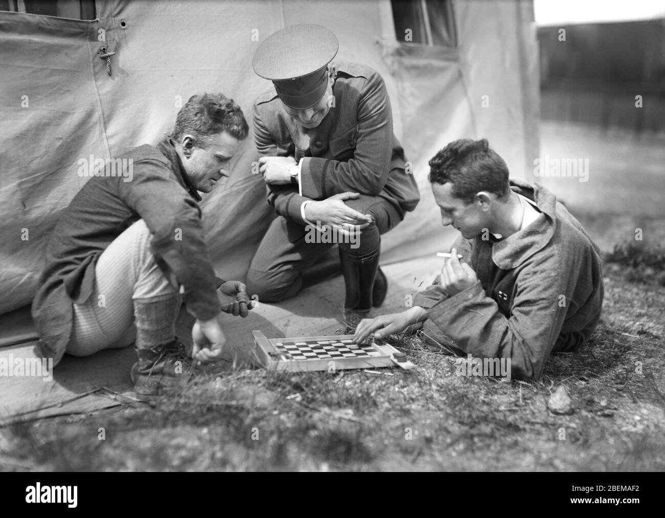 American Red Cross Man refereeing a Game of Checkers played by two ...