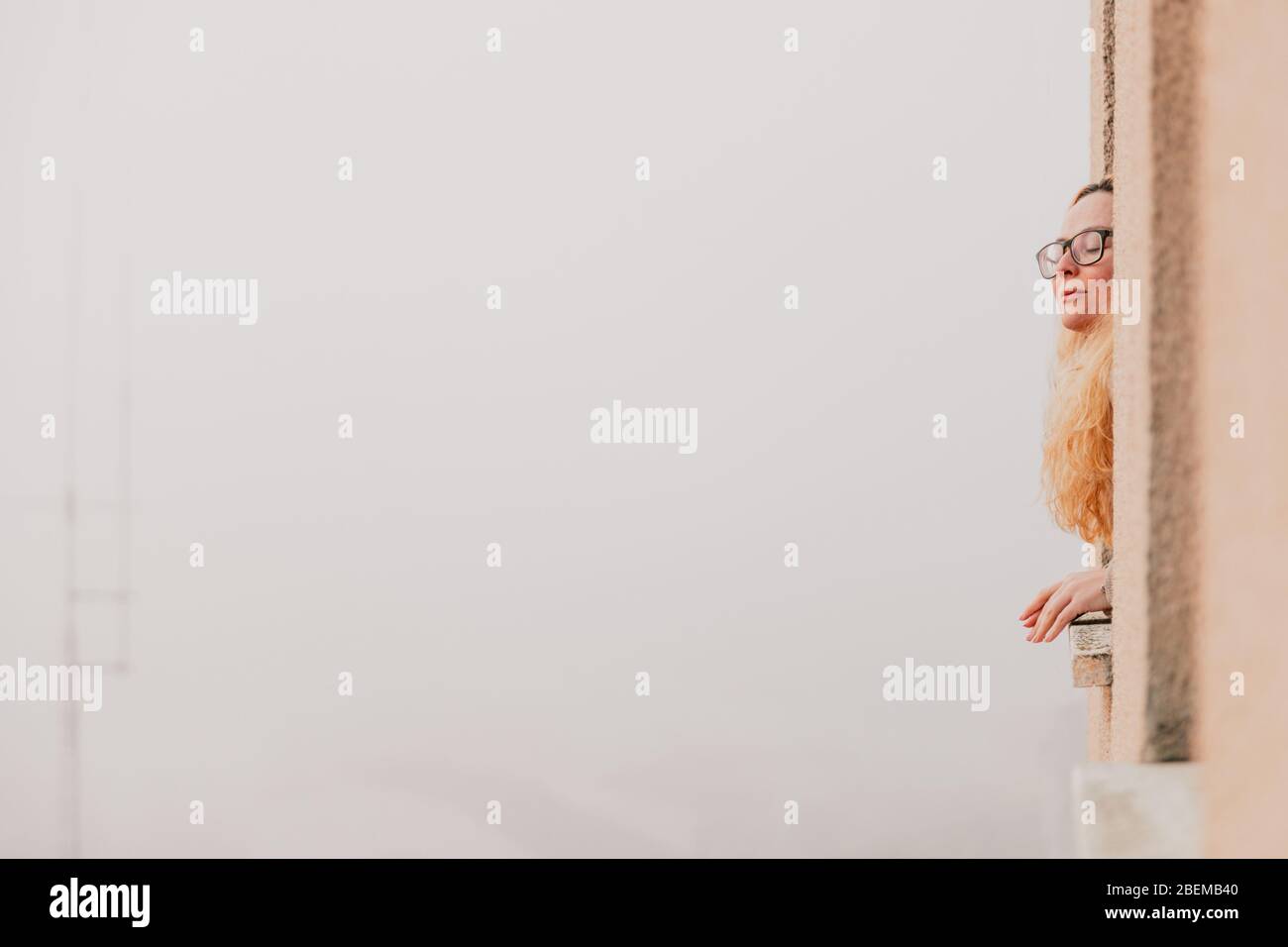 Bending over window hi-res stock photography and images - Alamy