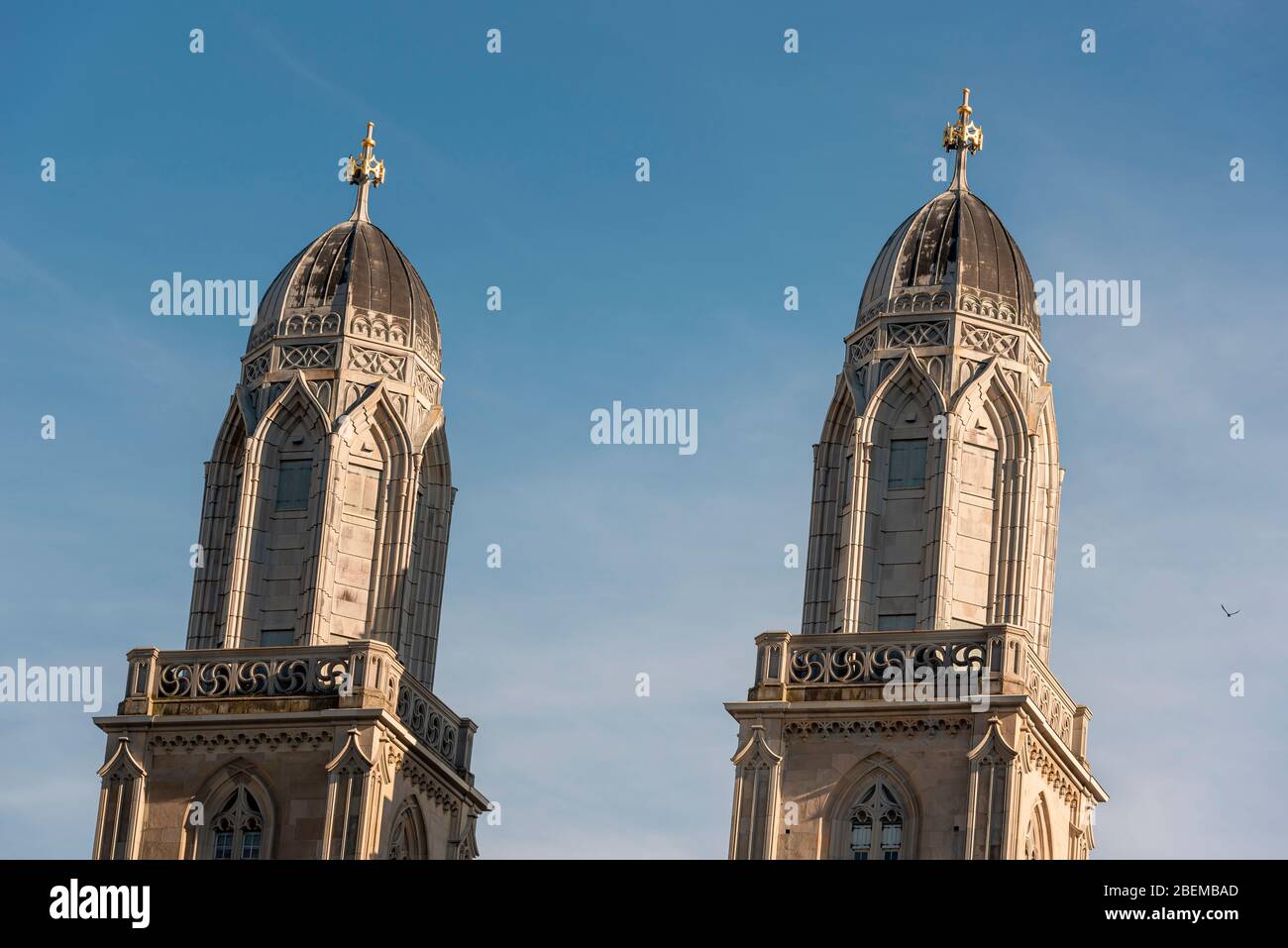 Two medieval church towers against a clear blue sky in the old city ...