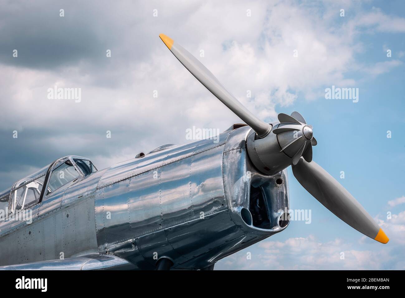 Old airplane with a single engine and propeller in front. Close-up on ...