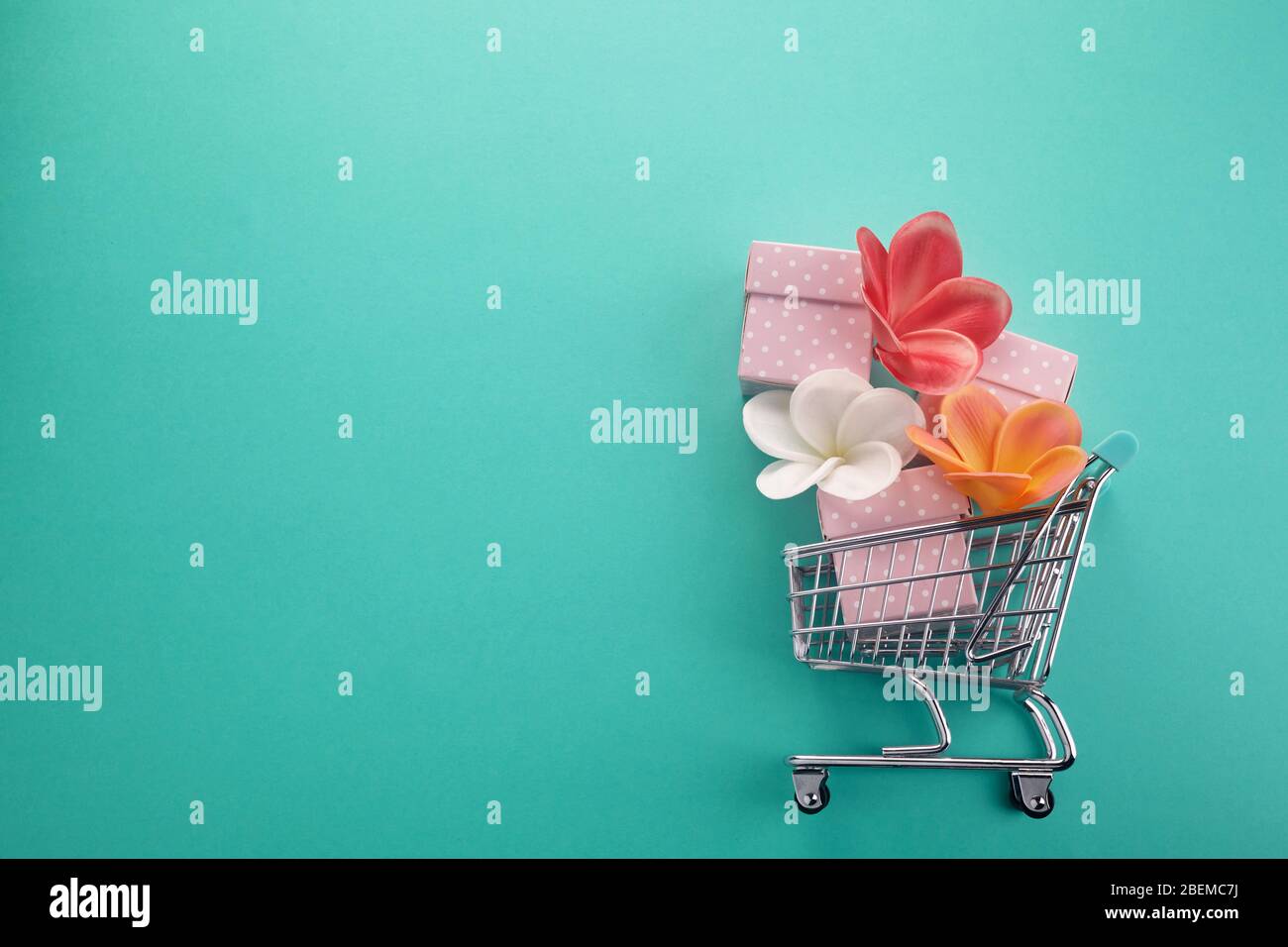 Spring shopping. Holiday shopping. Shopping cart background Stock Photo ...