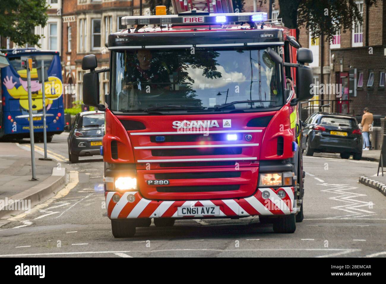 CARDIFF, WALES - JULY 2019: Fire engine with headlights on and blue ...