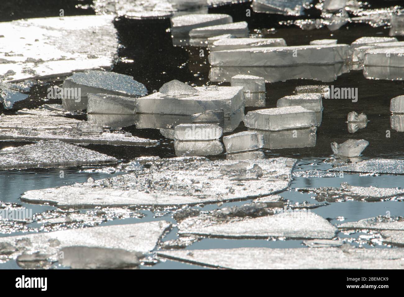 Ice breaking over the frozen water river Stock Photo - Alamy