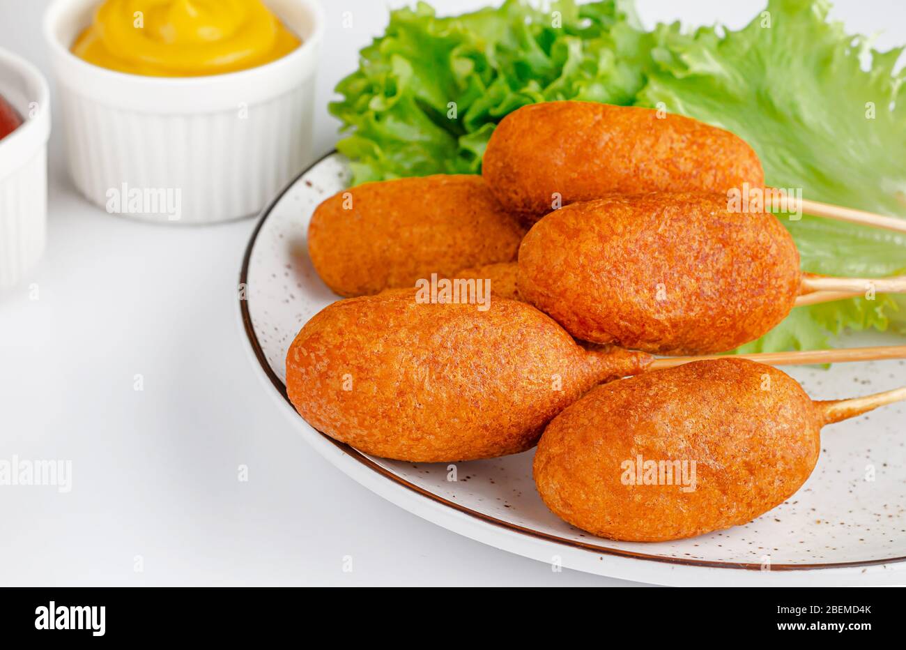 American fast food. Corn dogs on white background with mustard. Junk ...
