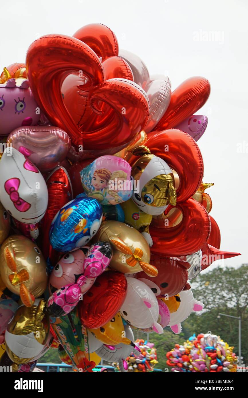 merchant selling colorful balloons in the streets of hanoi Stock Photo ...
