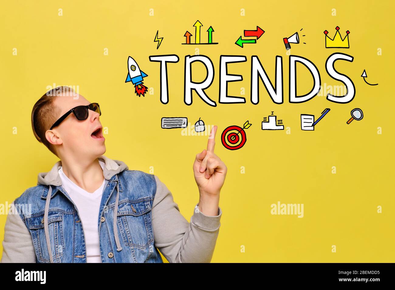 Trends concept - young guy smiles on yellow background. Close up Stock ...