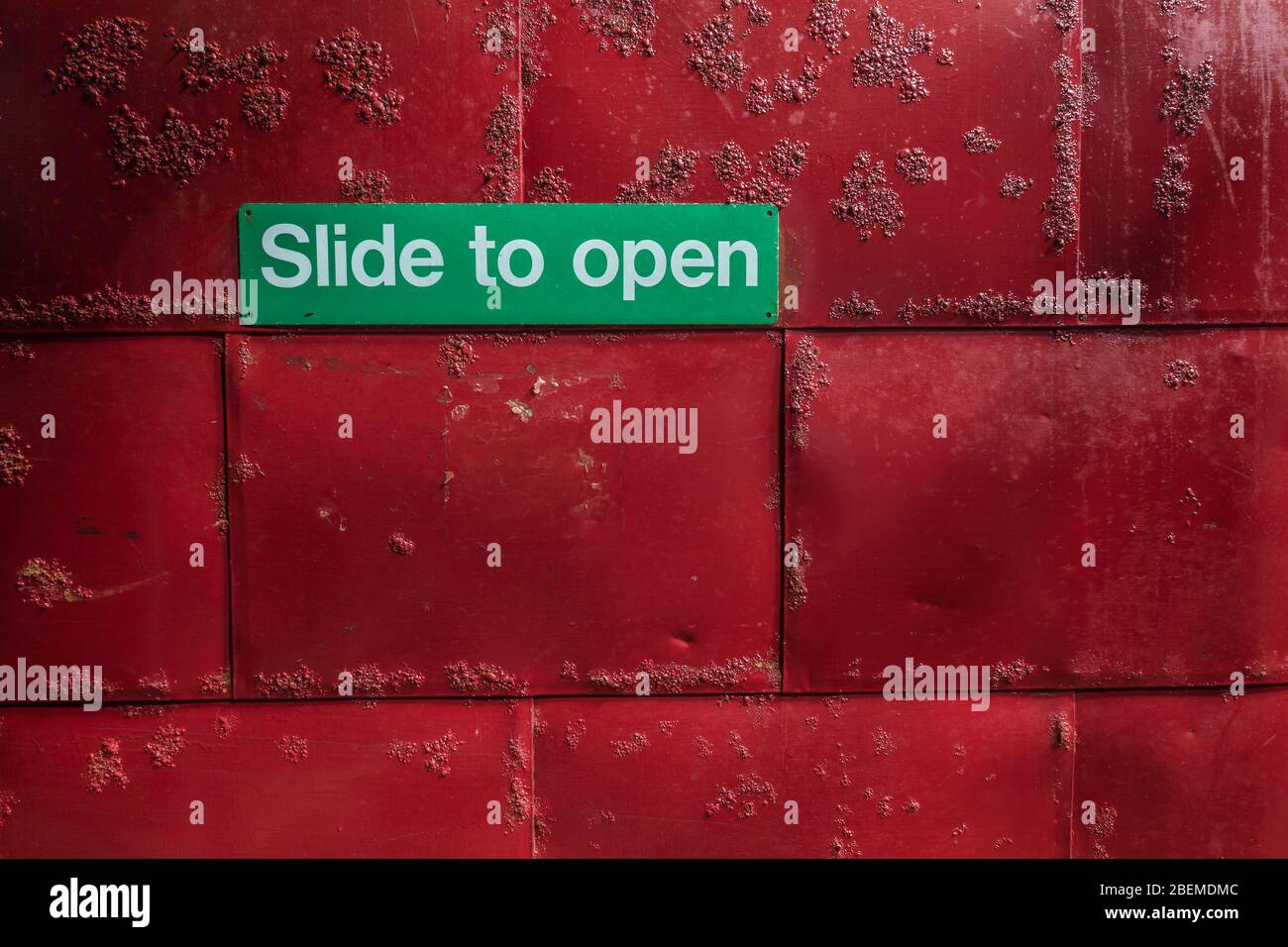 sign on an old warehouse door Stock Photo - Alamy
