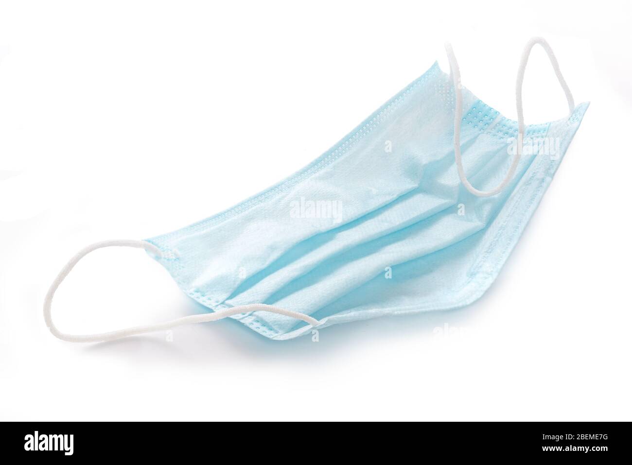 Blue individual medicine mask closeup white background Stock Photo - Alamy