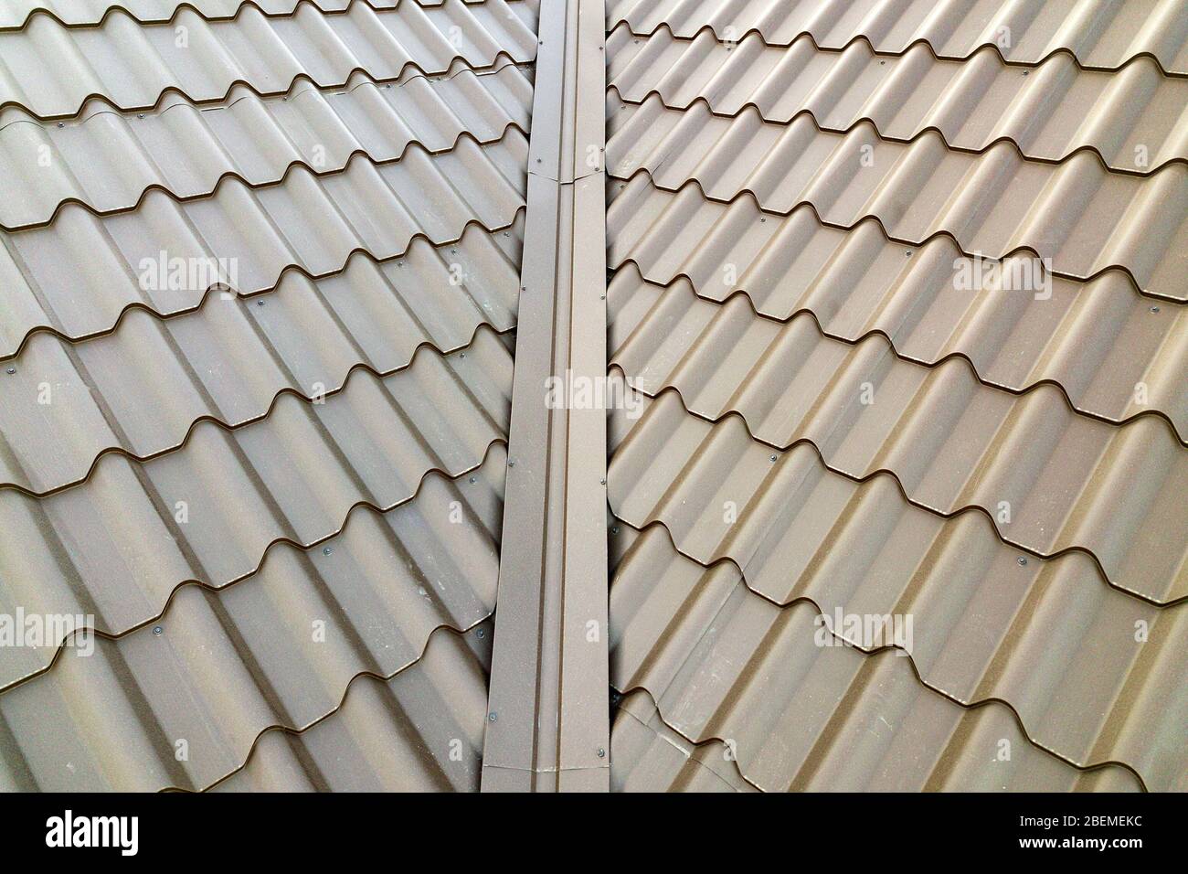 Close up of new house roof structure covered with metal tile sheets ...