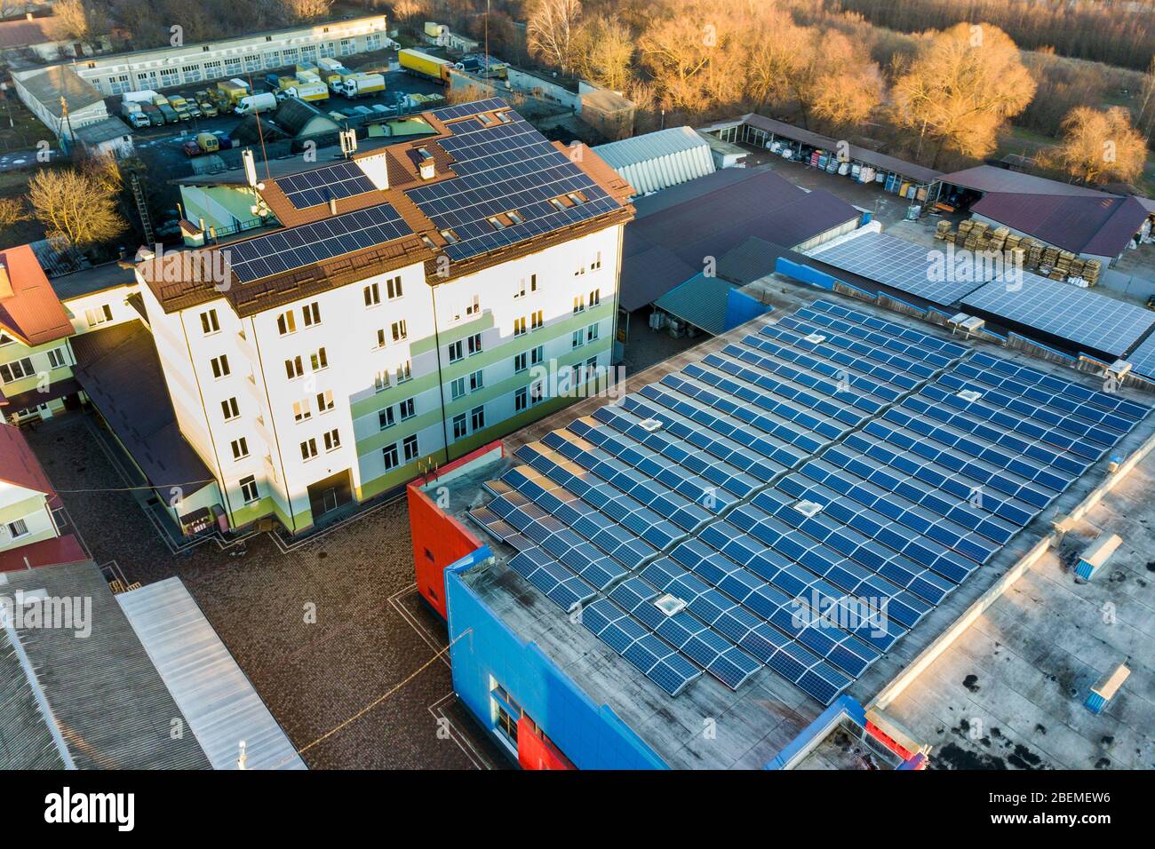 Aerial view of many photo voltaic solar panels mounted of industrial ...