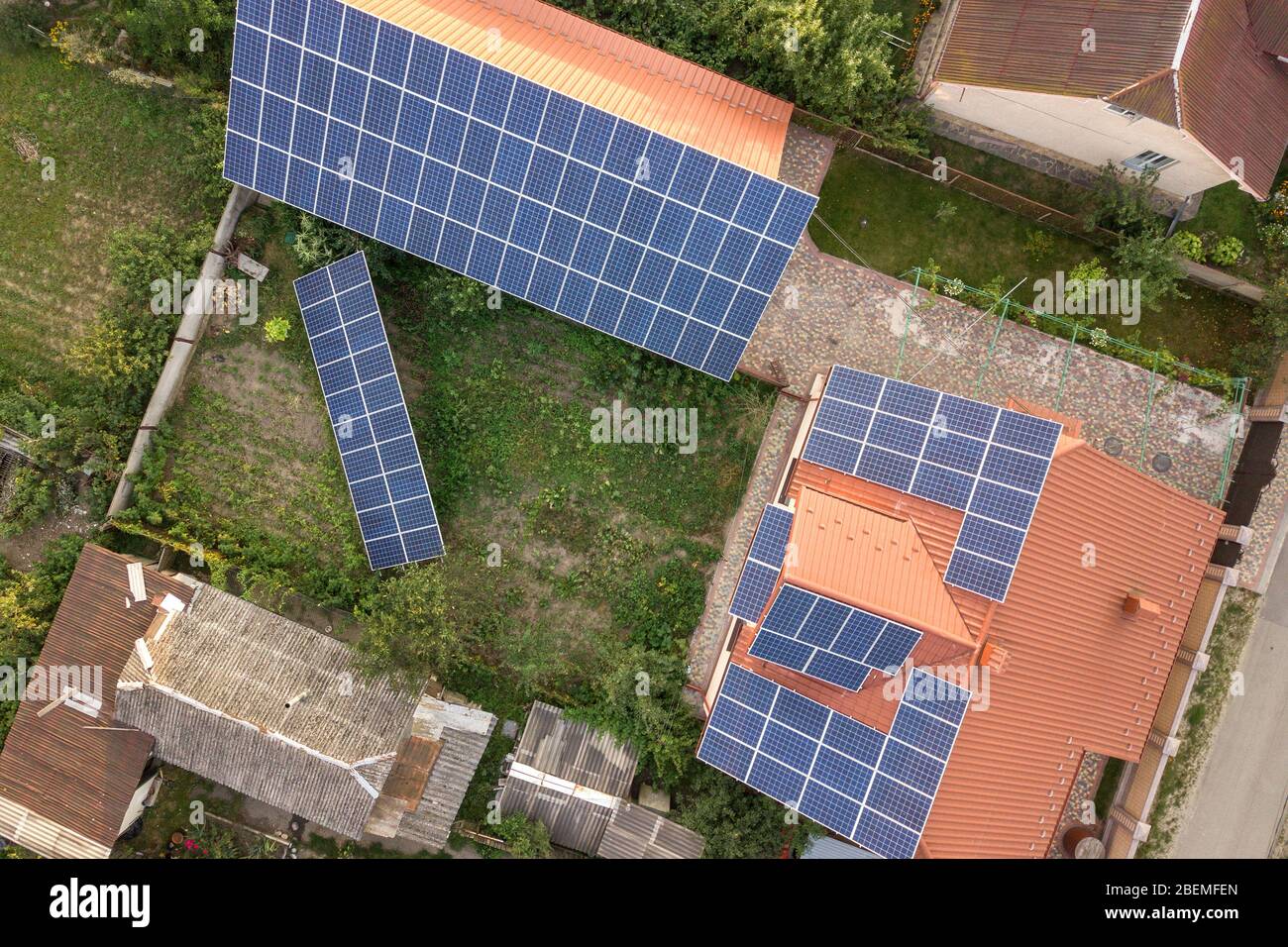 Aerial top view of new modern residential house cottage with blue shiny ...