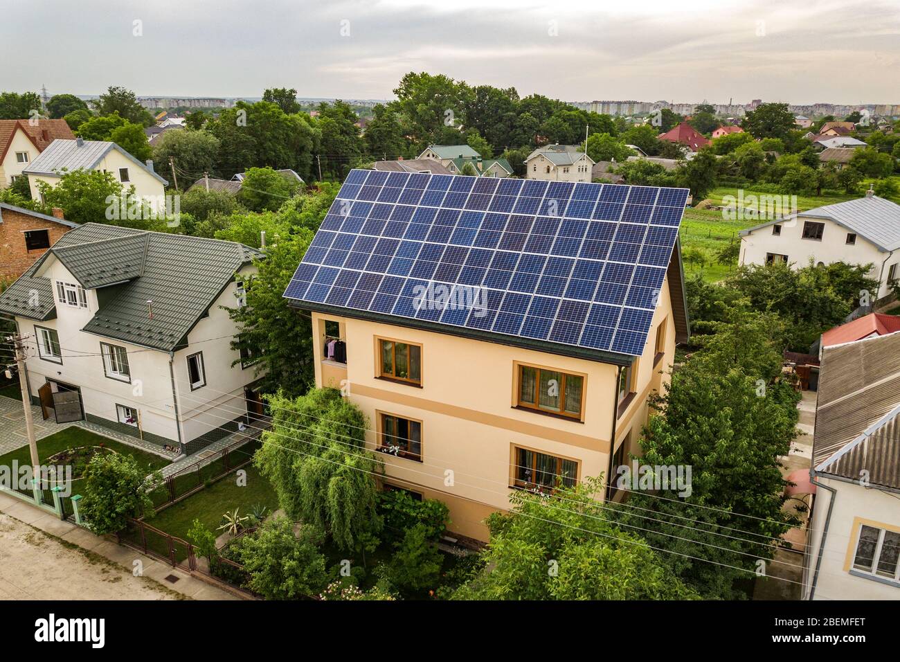 Aerial top view of new modern residential house cottage with blue shiny ...