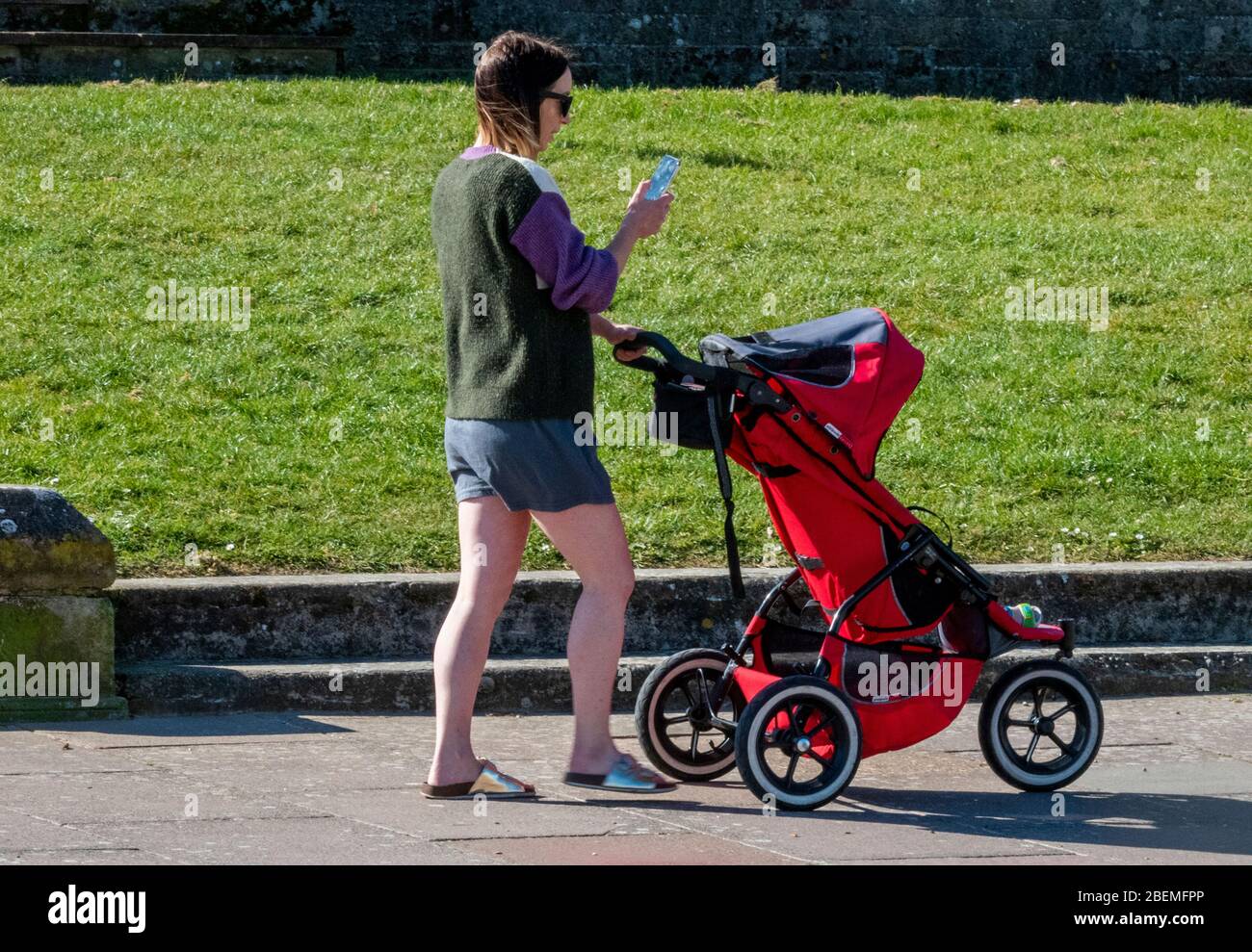 Woman Pushing Pram Phone High Resolution Stock Photography and Images ...