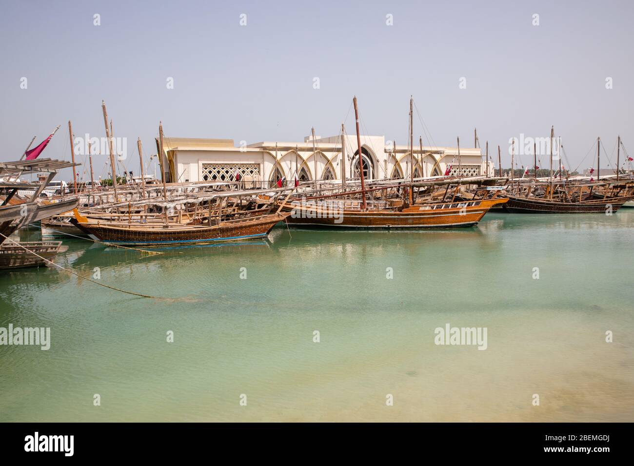 View on wooden ships and Dhow Harbour building in Doha City, Qatar ...