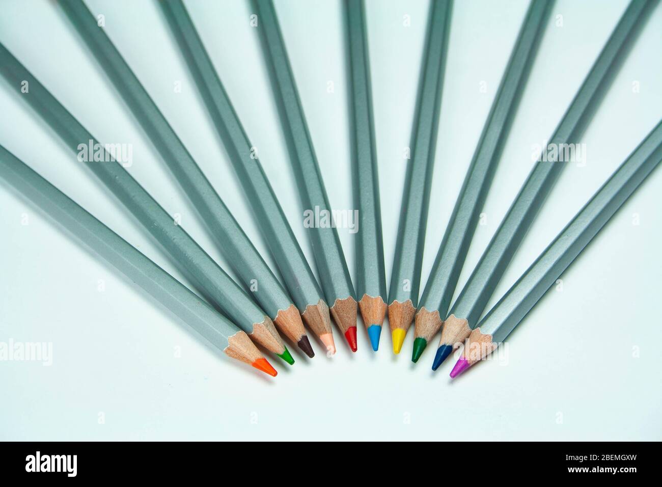 Colored pencils on a white background top viewed Stock Photo - Alamy