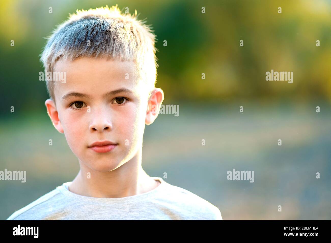 Portrait of a child boy outdoors on a warm sunny summer day Stock Photo ...