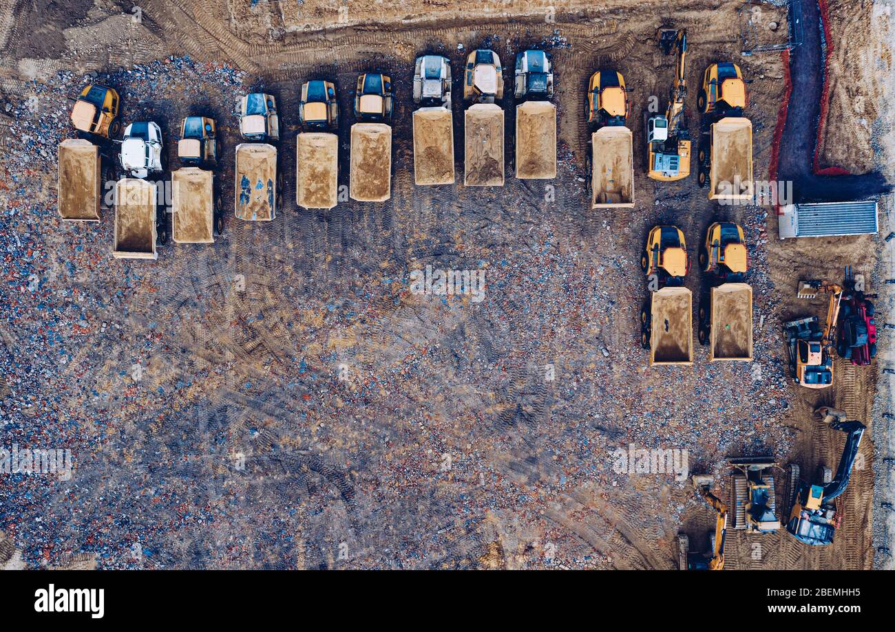Aerial above view on heavy tipper trucks with copy space Stock Photo ...