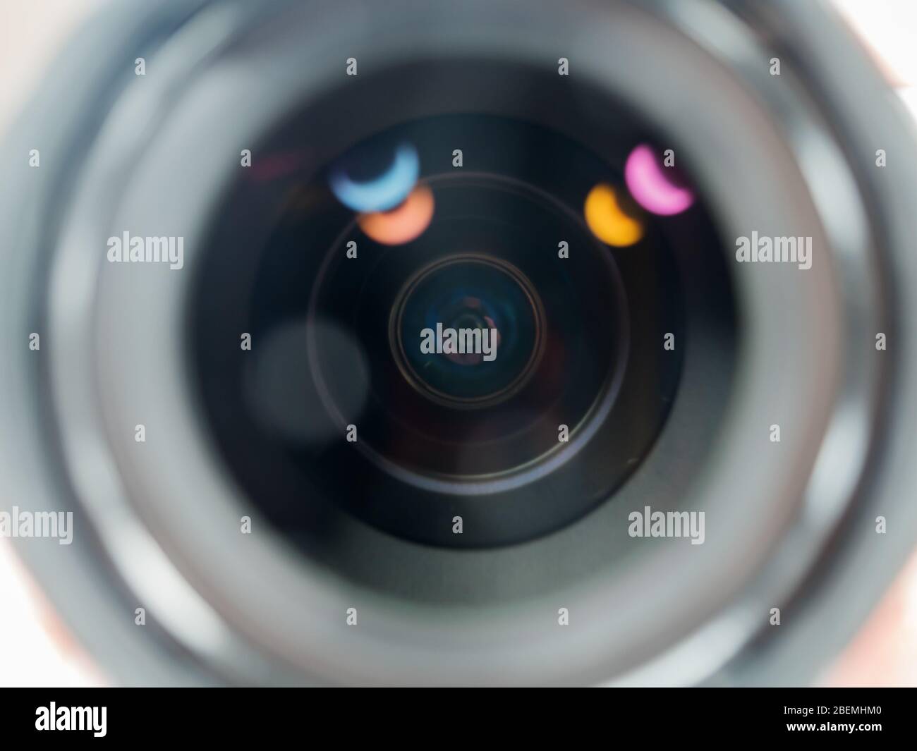 Close-up photo with focus in the center and blur around the camera lens ...