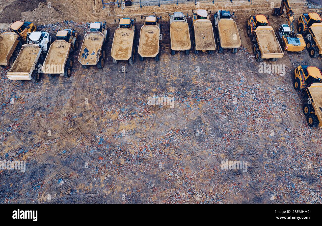 Aerial above view on heavy tipper trucks with copy space Stock Photo ...