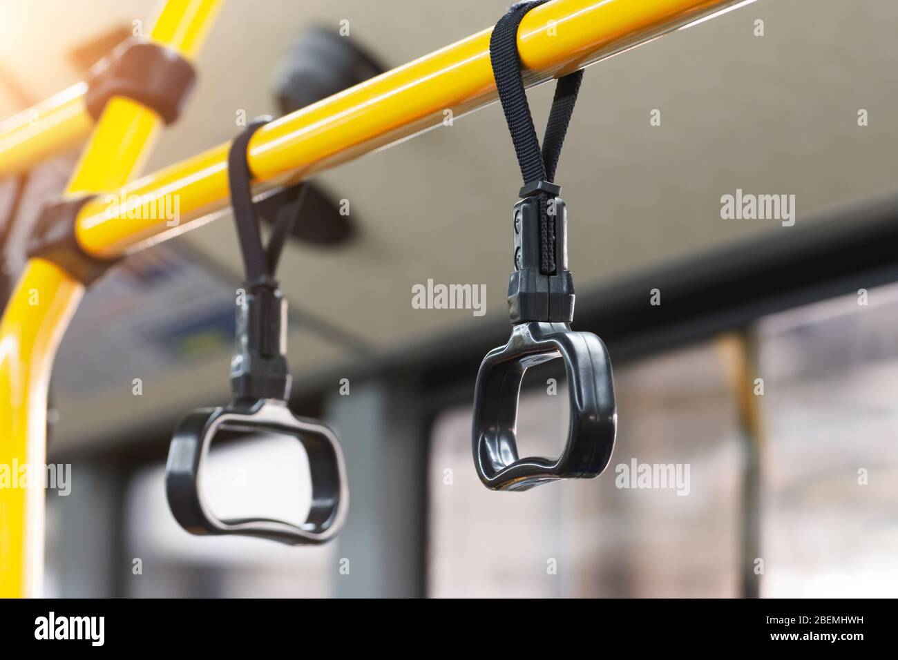 Yellow handrails and black handles to hold passengers steady while the ...