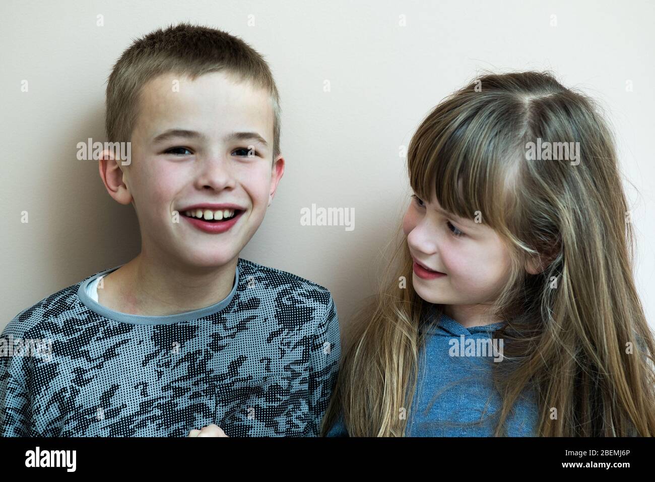 Two children boy and girl fooling around having fun together. Happy ...