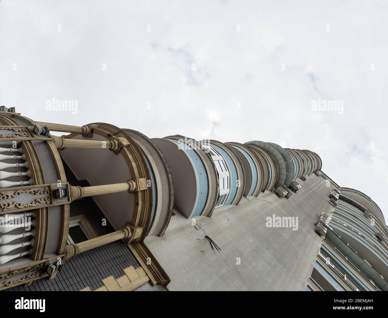 Round balconies with decorative elements on the corner of the house ...