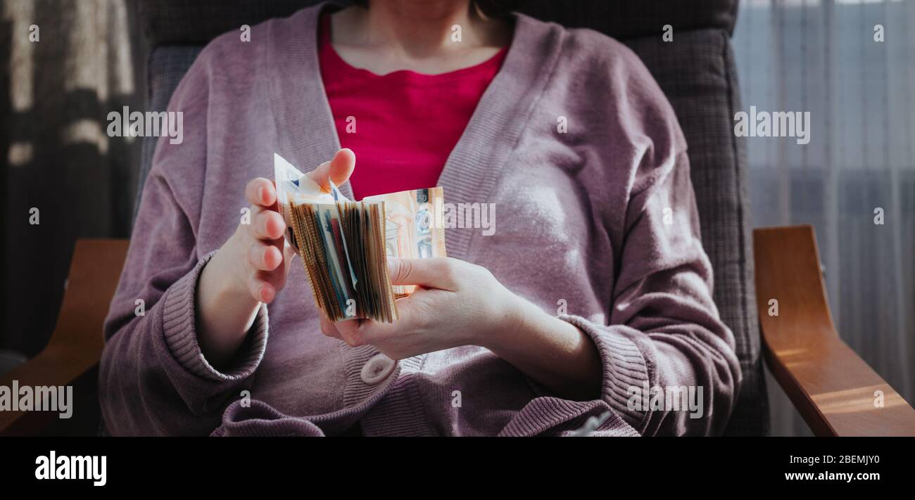 Woman counting thousands euro hi-res stock photography and images - Alamy