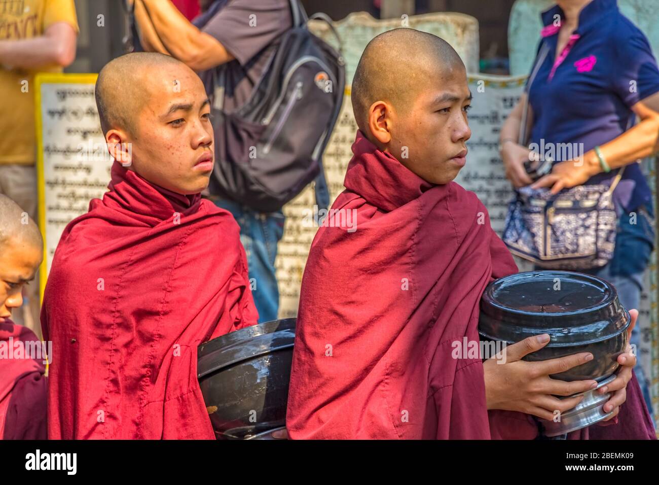 Novice monks with tourists hi-res stock photography and images - Alamy