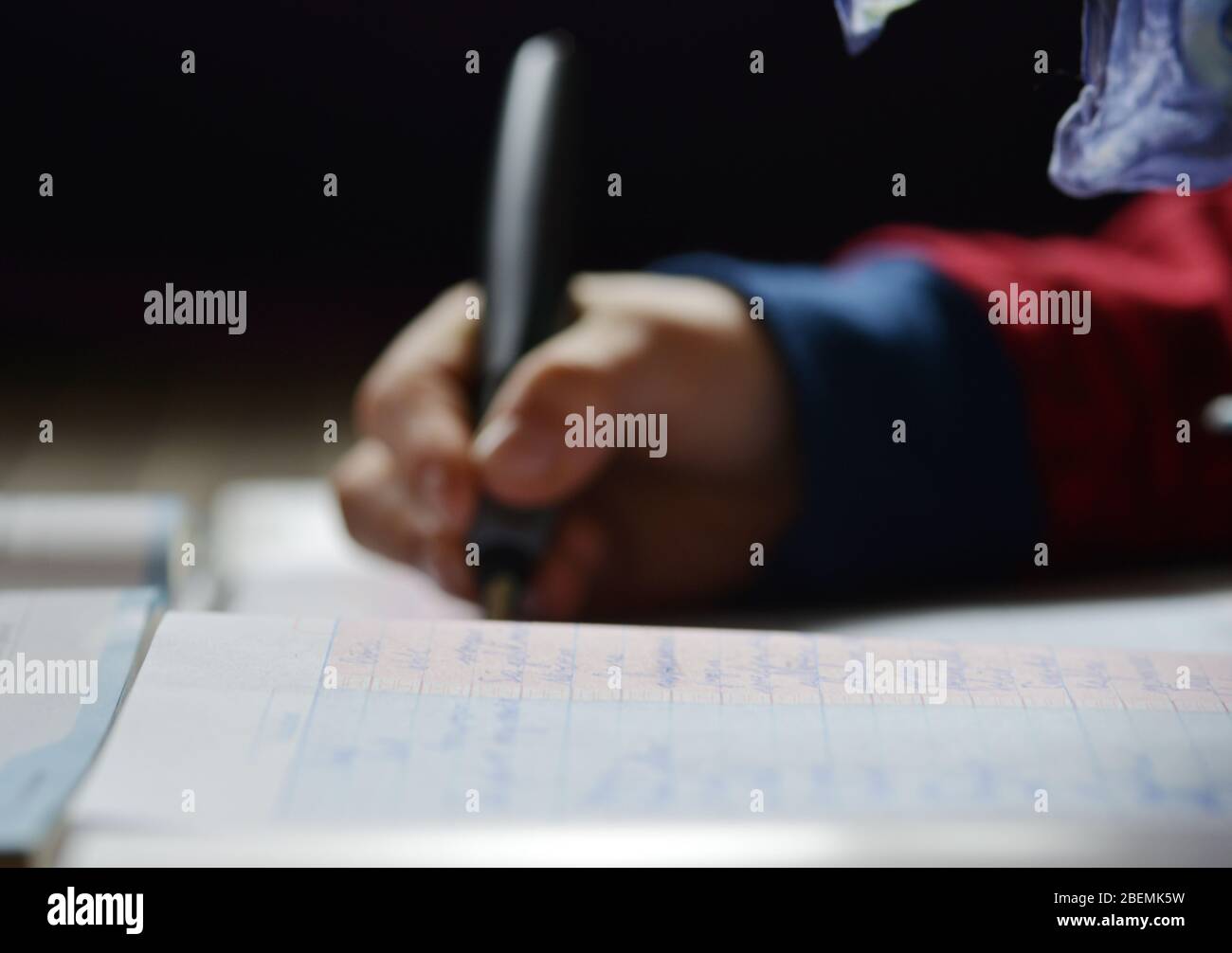 School handwriting a lesson into a notebook with a ink pen Stock Photo ...