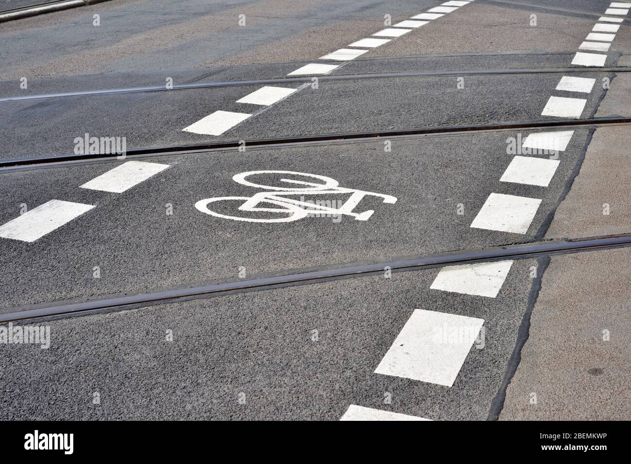 Road with tram tracks crossing a bicycle road Stock Photo - Alamy