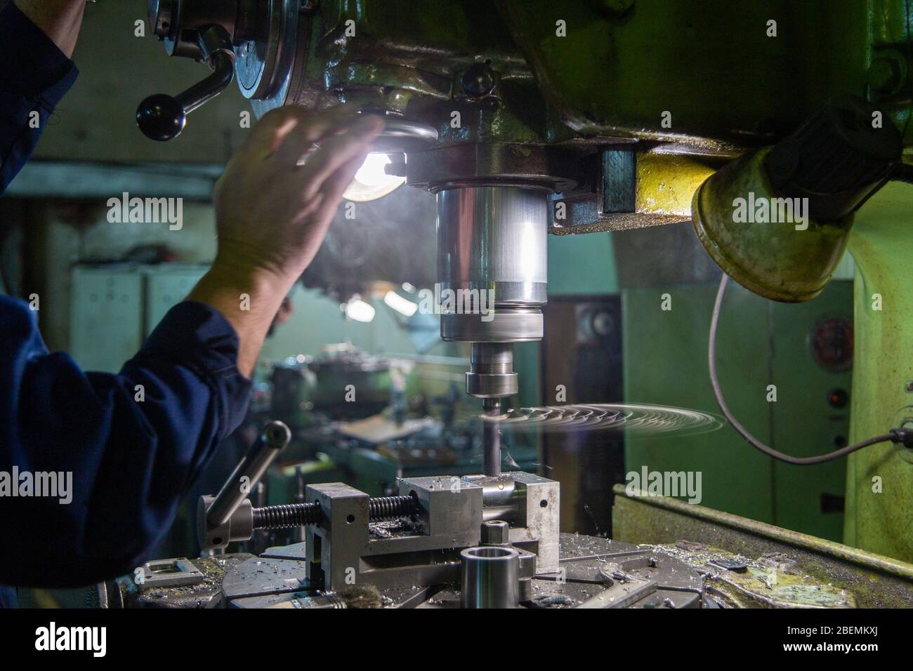 Industrial steel drilling process with smoke close-up with selective ...