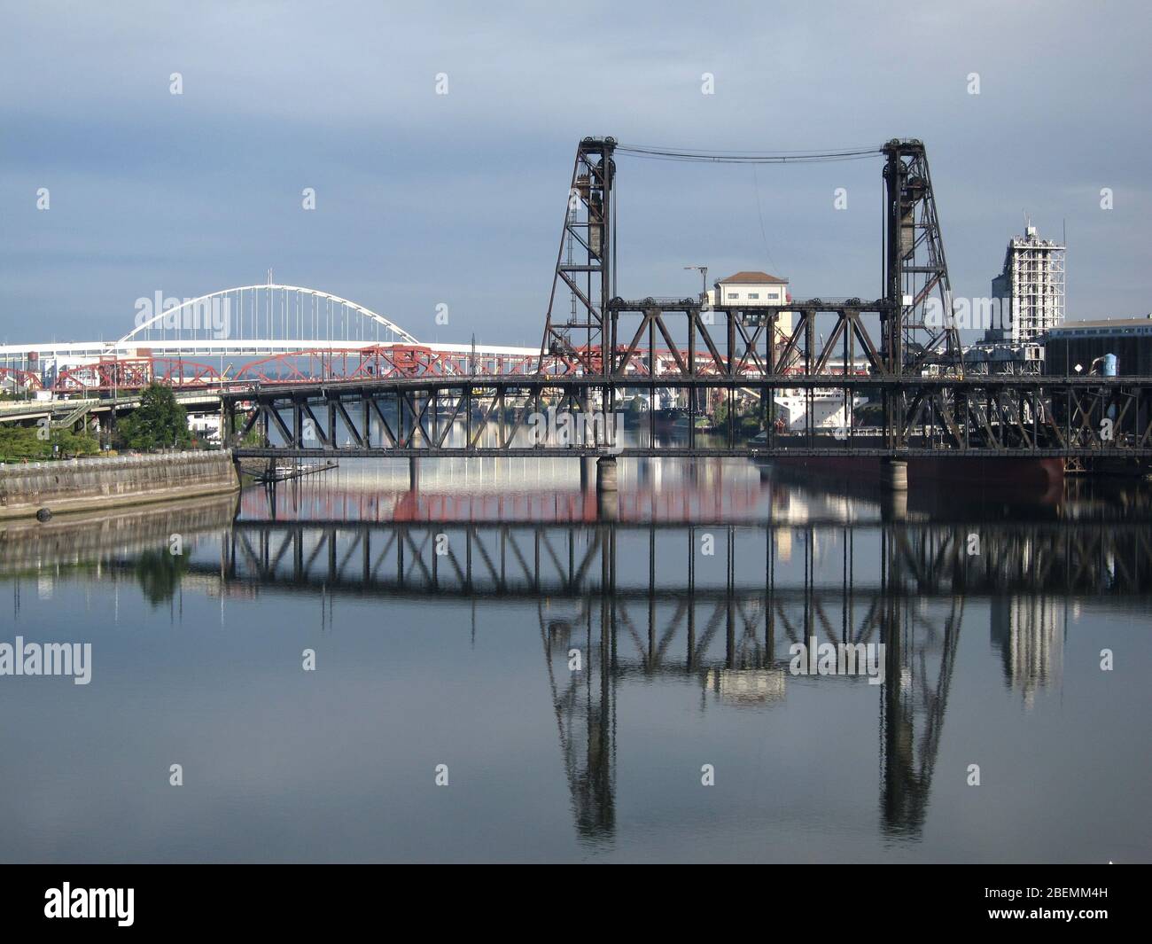 Reflections of the telescoping rail and road Steel Bridge over the ...