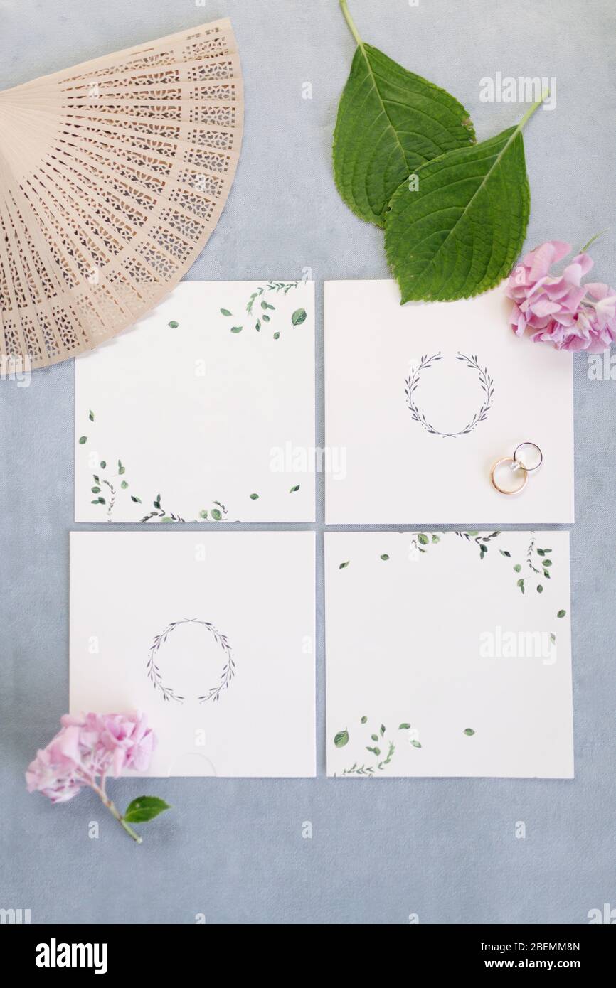 Wedding invitation. Empty white floor. Wedding rings. Fan and purple ...