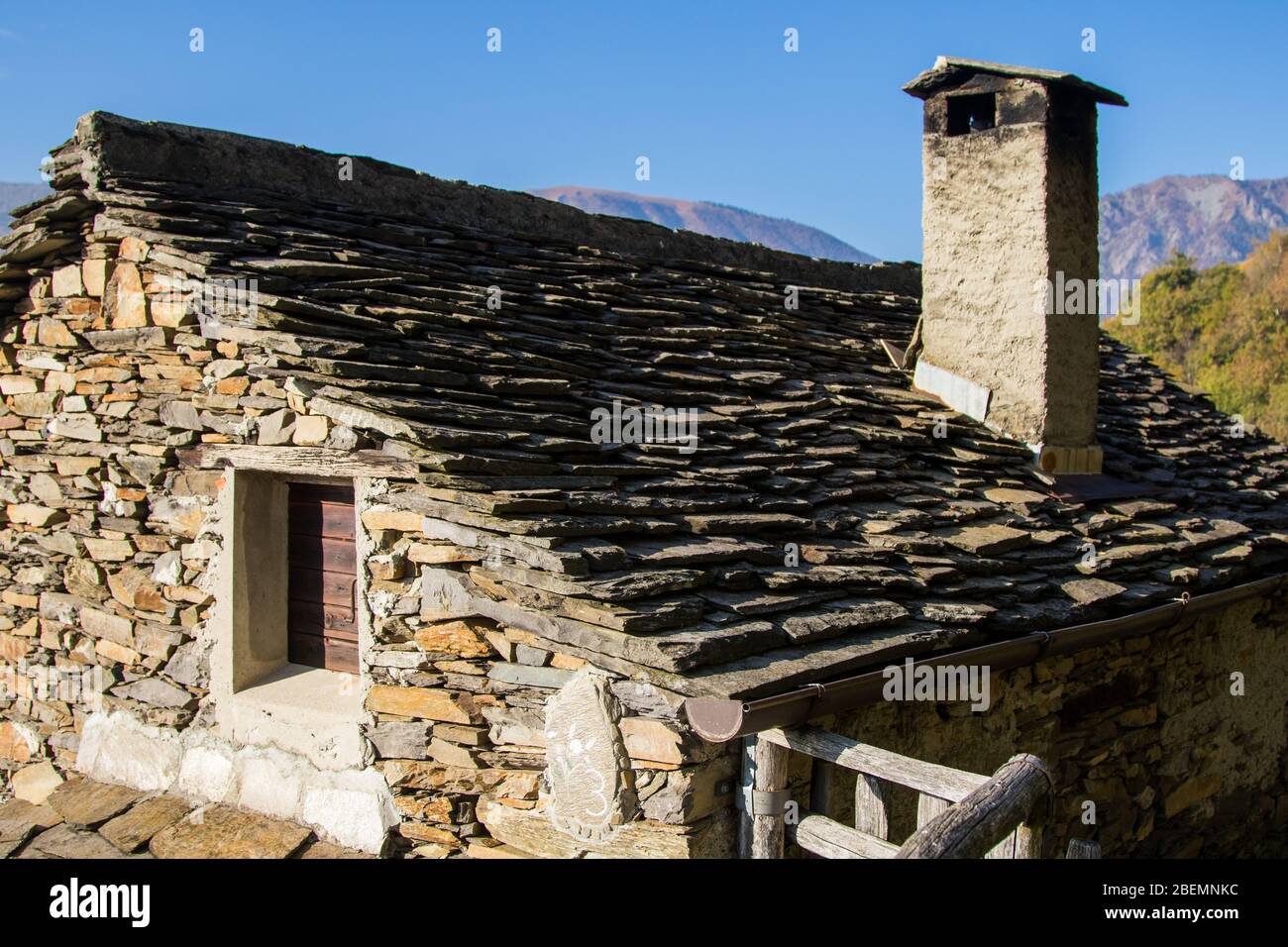 old alpine village built on top of a mountain. Bell towers,Houses and ...