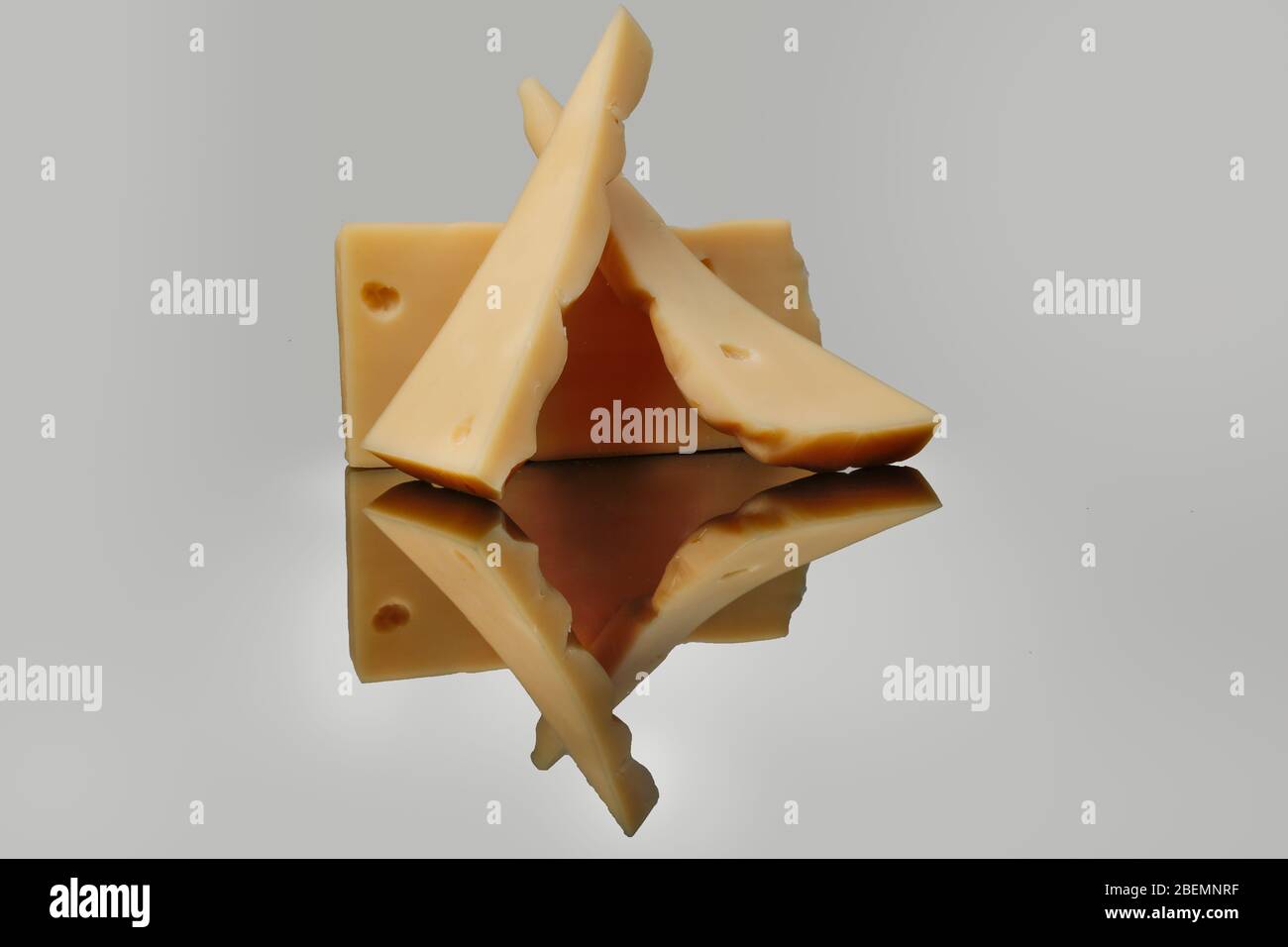 Pieces of Cheese isolated on a grey background. With Clipping Path ...