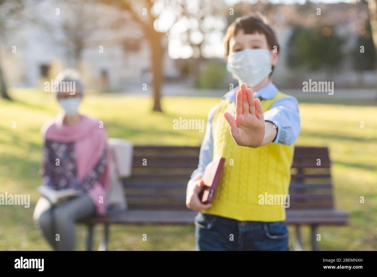 Boy giving stop sign asking for social distancing, focus on hand Stock ...