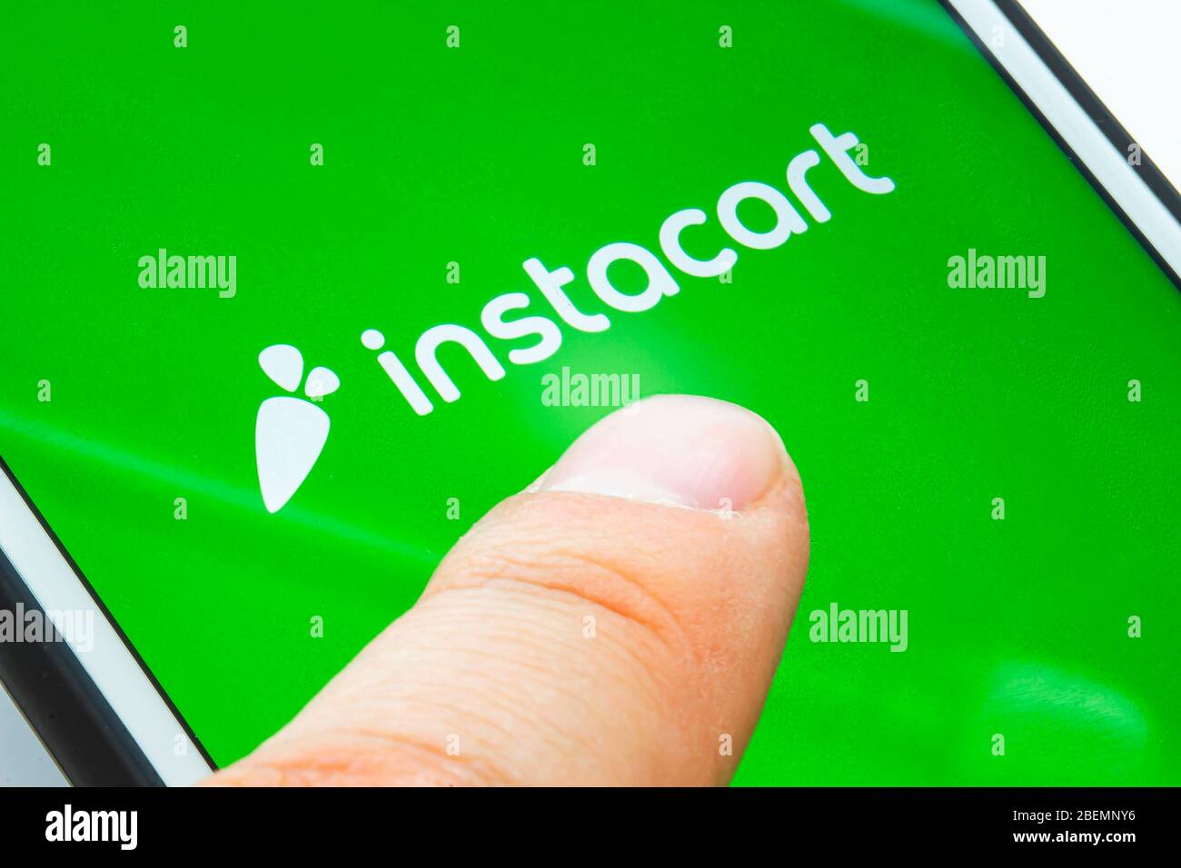 Calgary, Alberta. Canada. April 11, 2020. A person using the Instacart ...