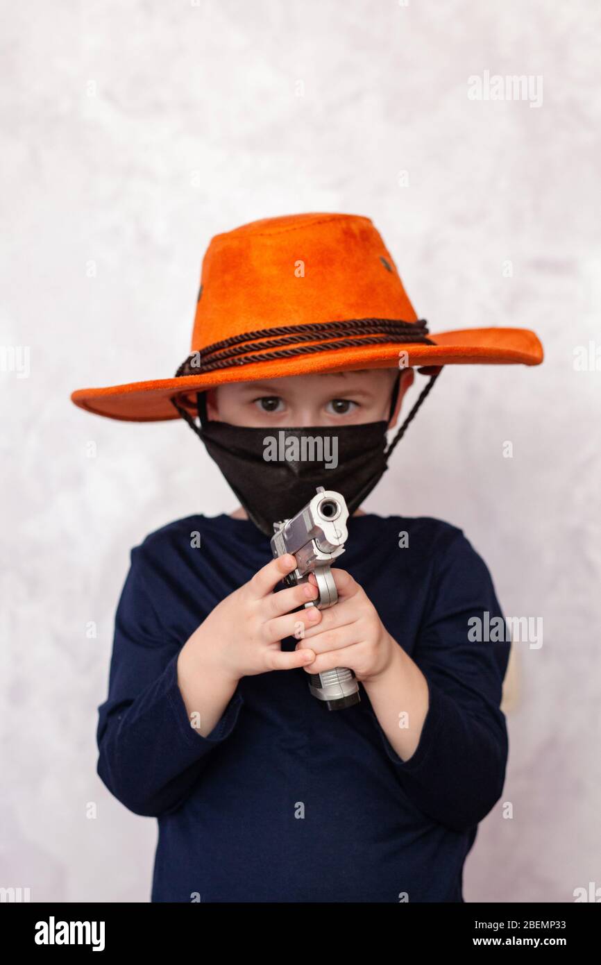 Boy playing plastic toy gun hi-res stock photography and images - Alamy