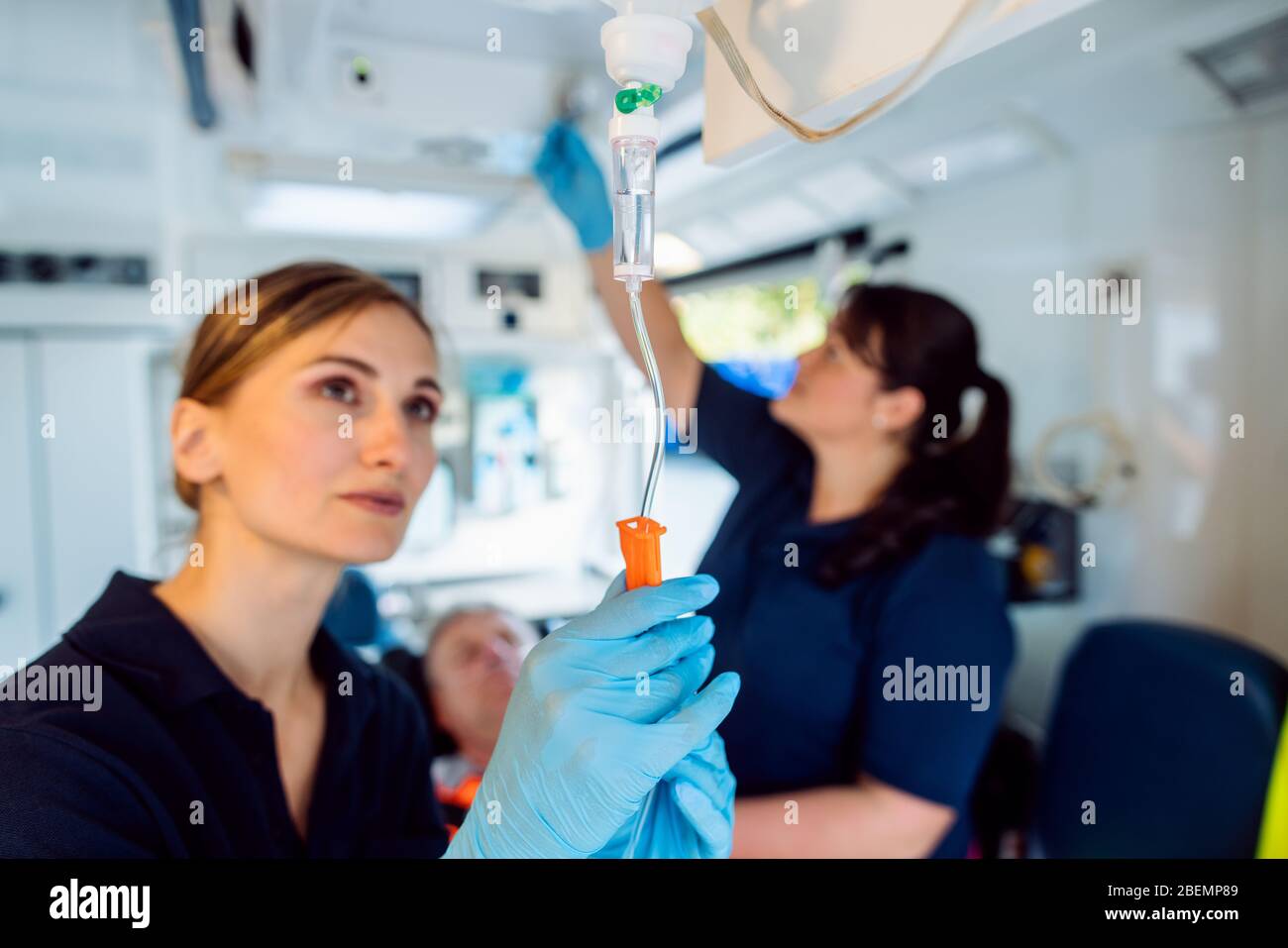 Paramedic looking after the drop injection in an ambulance Stock Photo ...