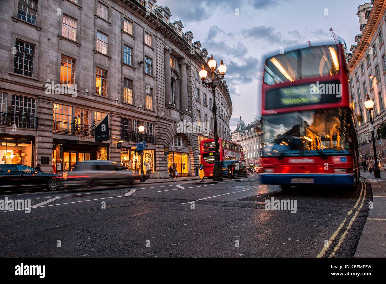 Regent Street, London, United Kingdom. Moving photo of a typical red ...