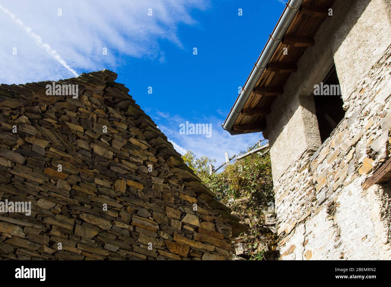 old alpine village built on top of a mountain. Bell towers,Houses and ...