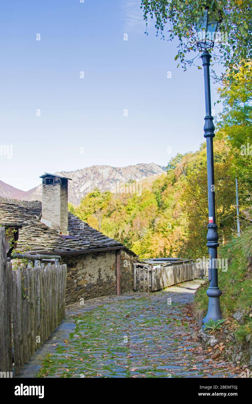 old alpine village built on top of a mountain. Bell towers,Houses and ...