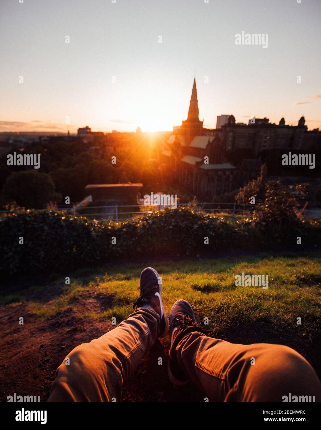 Sitting perspective watching the sunset on top of the Glasgow ...