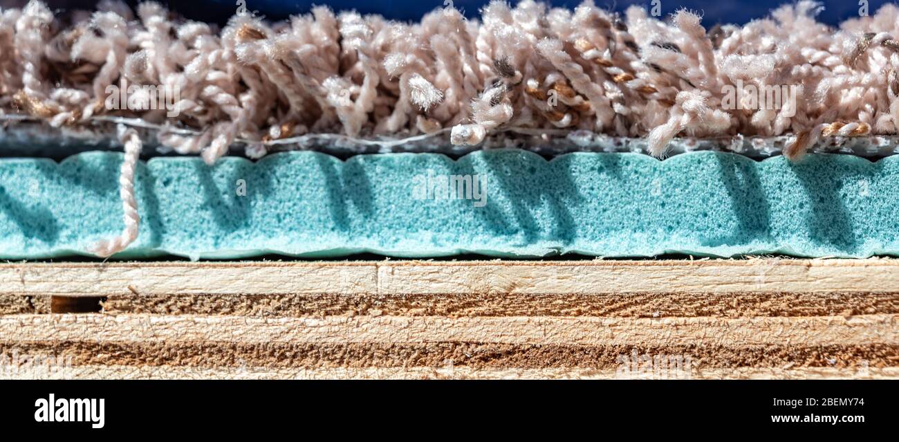 Carpet, padding, and plywood layers for installation of flooring Stock ...