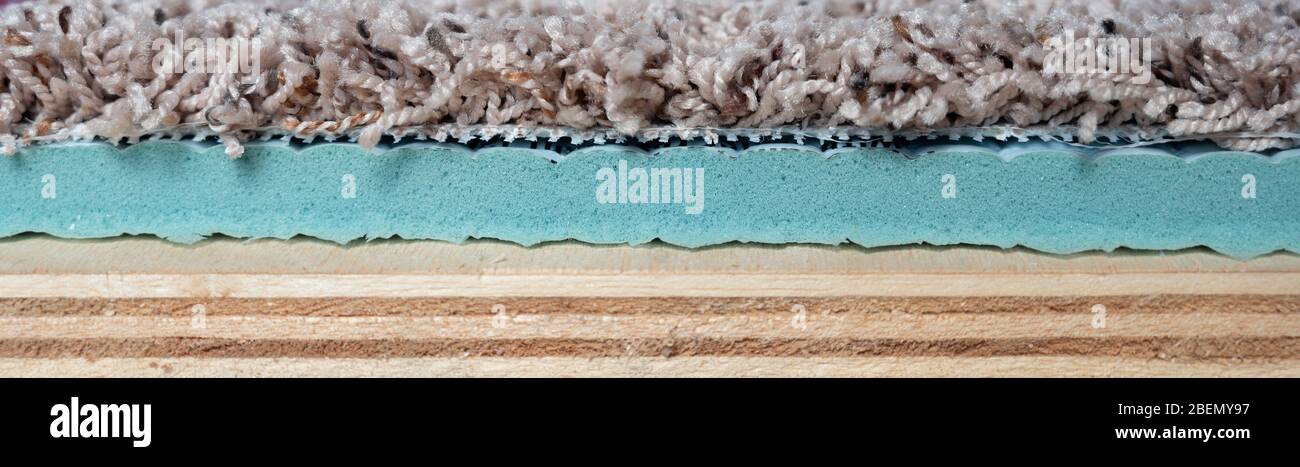 Carpet, padding, and plywood layers for installation of flooring Stock ...