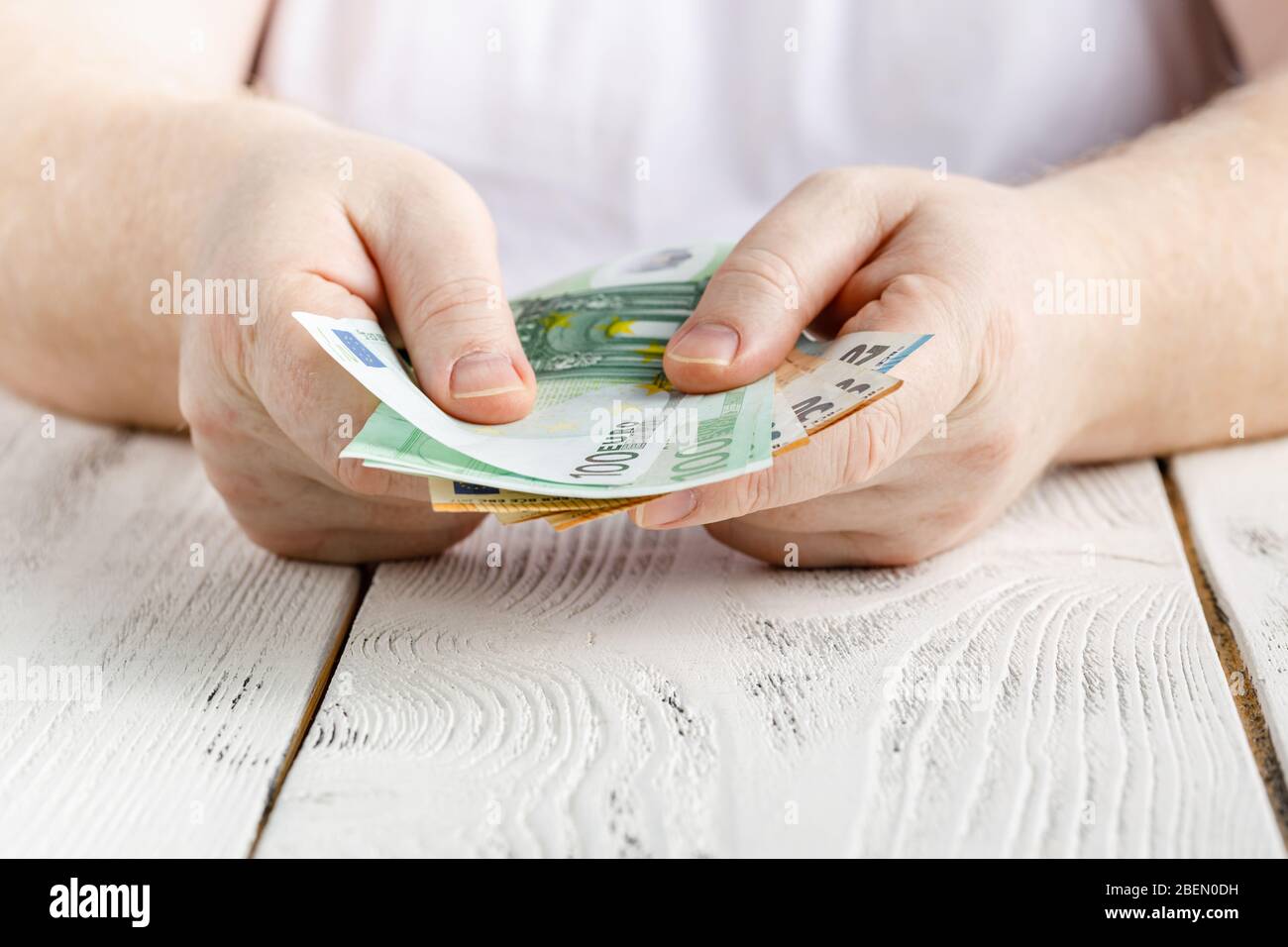 Hands holding a lot of money banknotes Stock Photo - Alamy