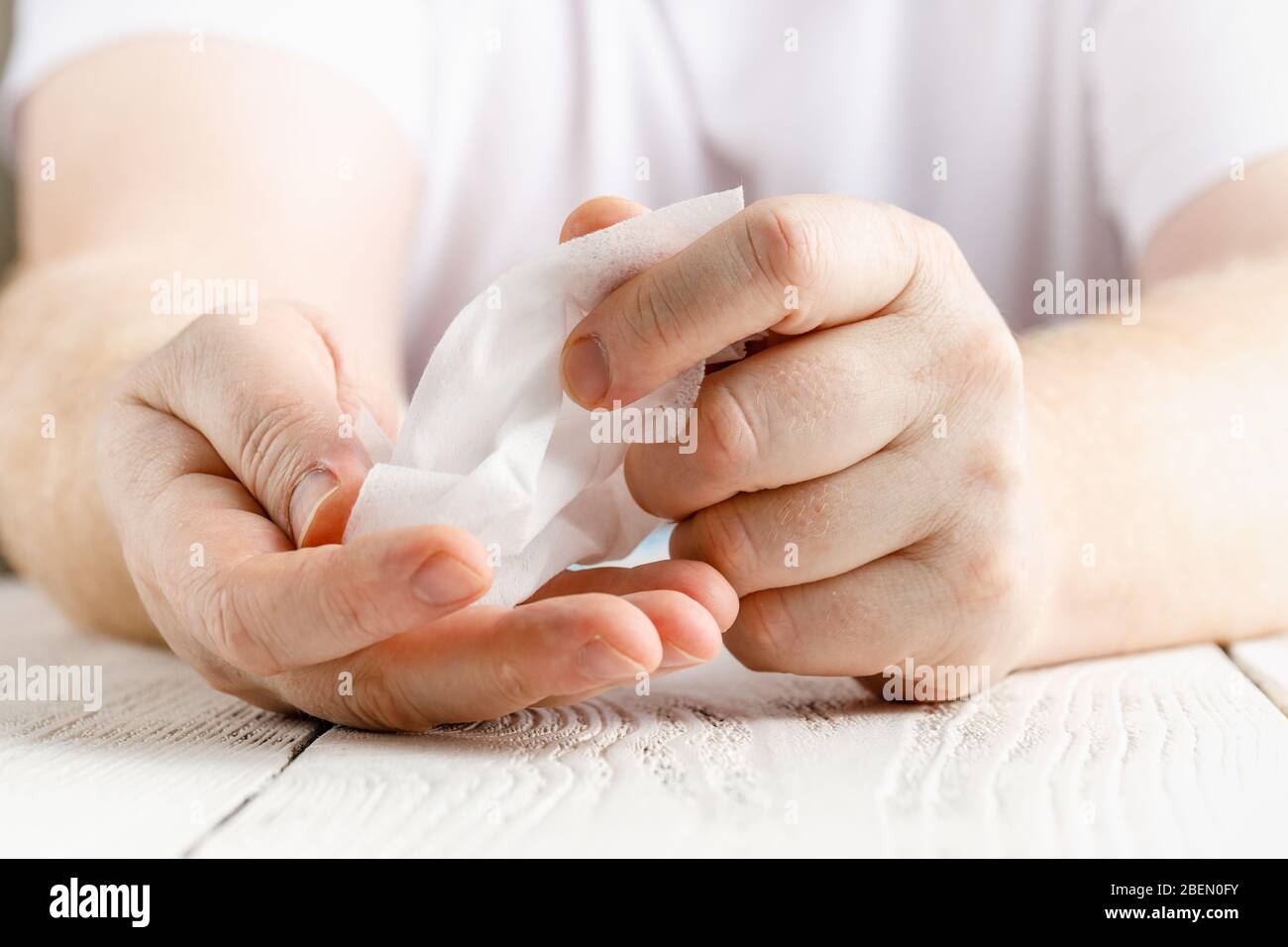 hand applying alcohol wipe hand sanitiser to prevent the spread of ...