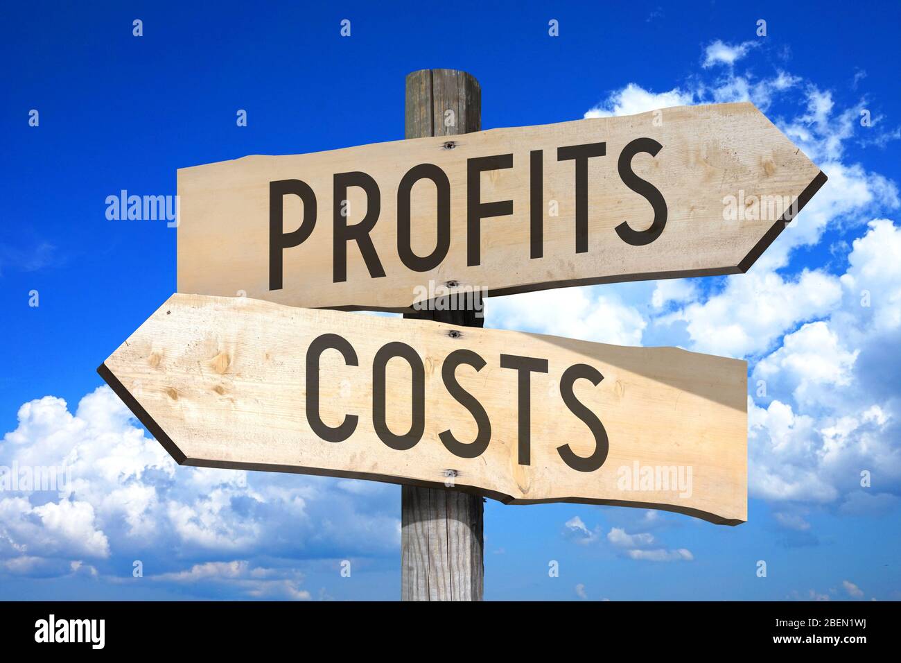 Wooden signpost with two arrows, sky Stock Photo - Alamy