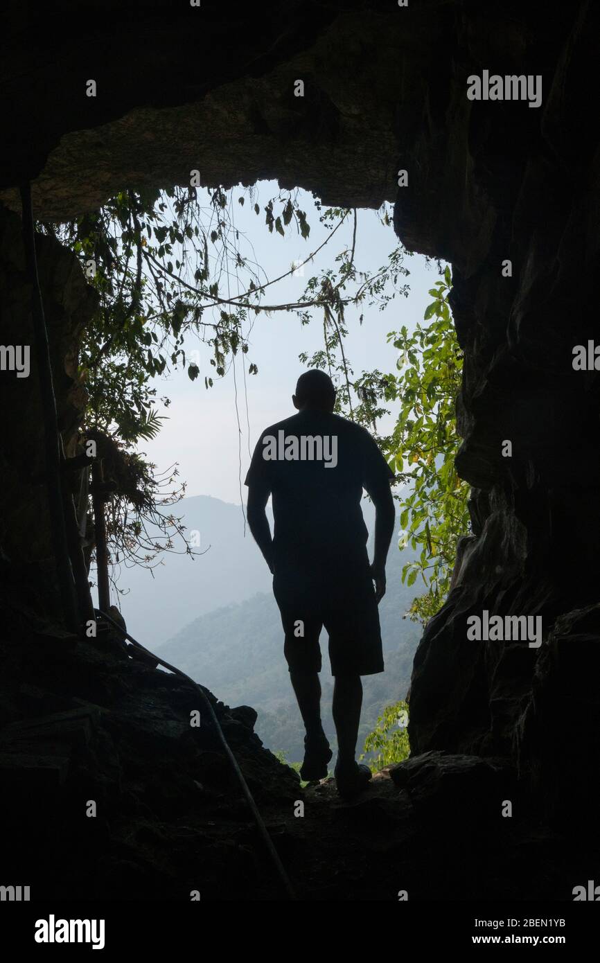 Man standing outside a cave hi-res stock photography and images - Alamy