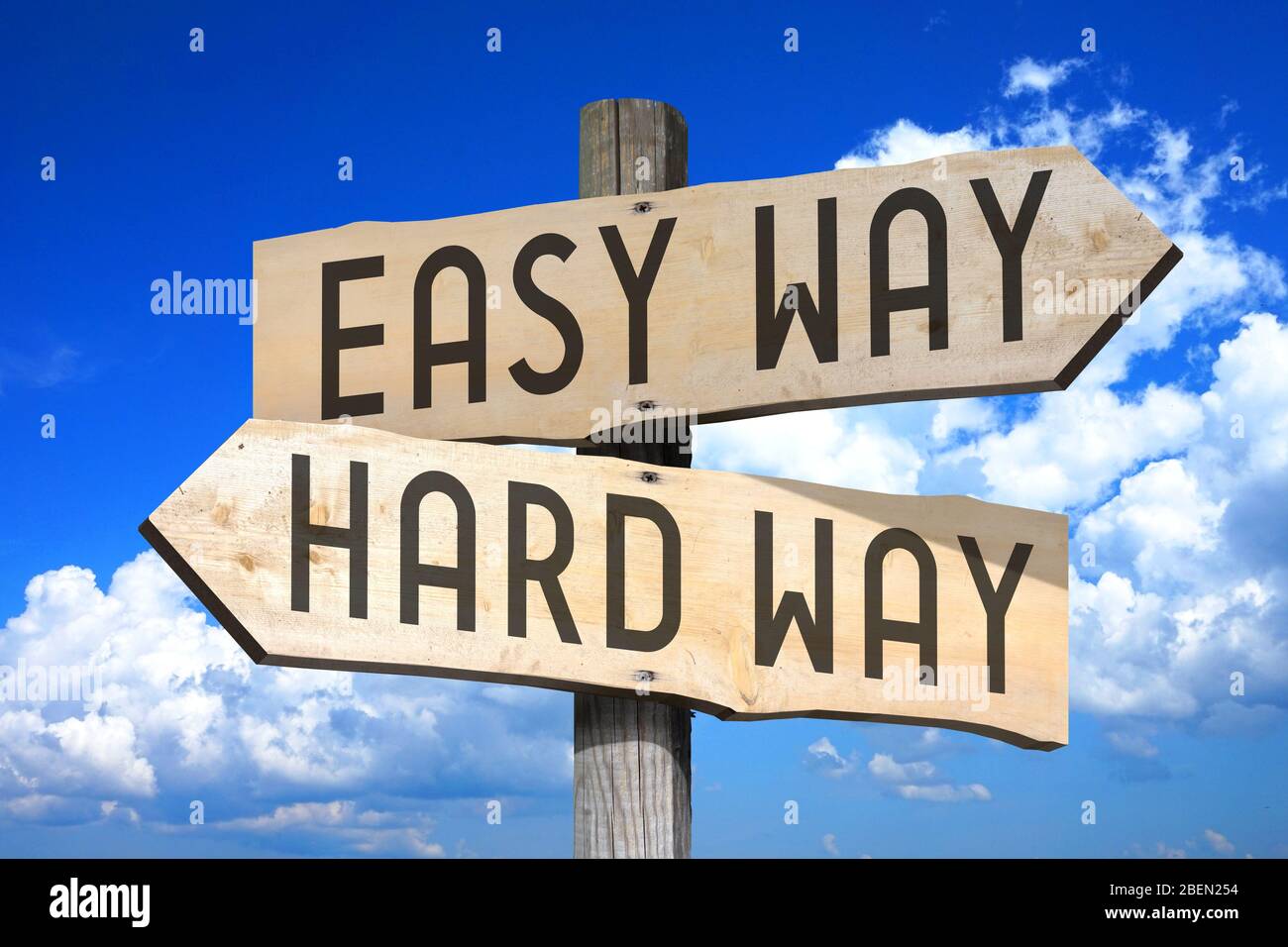 Wooden signpost with two arrows, sky Stock Photo - Alamy